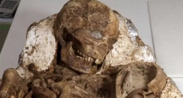 Stone Age mum found cradling baby